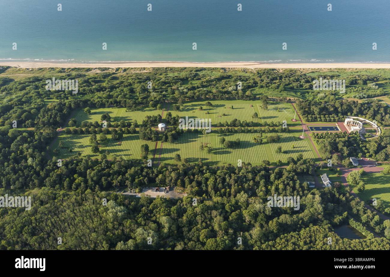 Aerial view of the solemn American Cemetery's white crosses and the ...