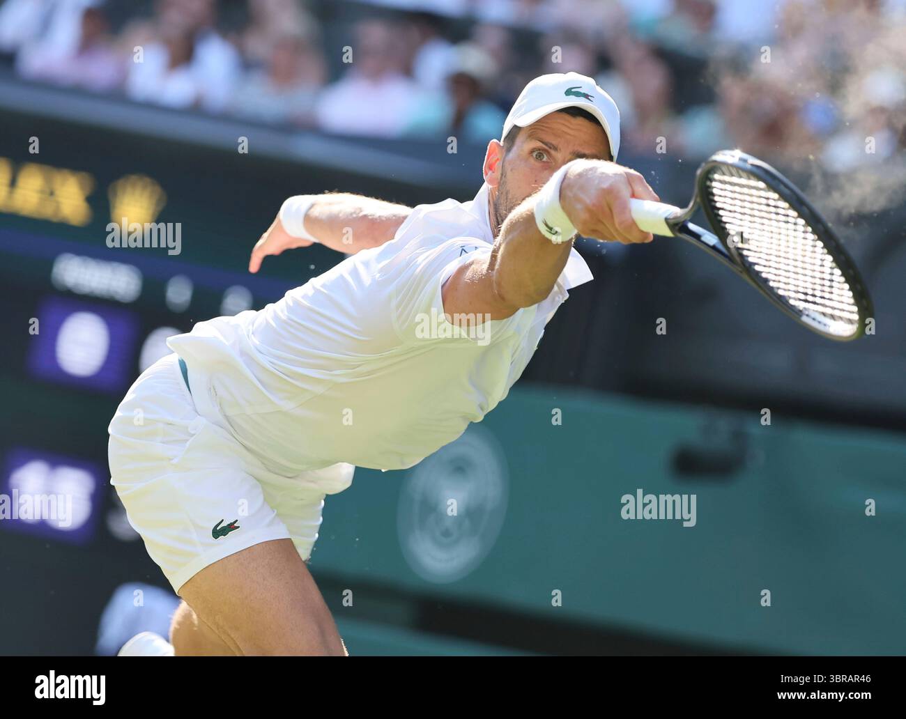 Novak Djokovic of Serbia hits a ball during gentlemen's singles semi-finals match against Jannik ...