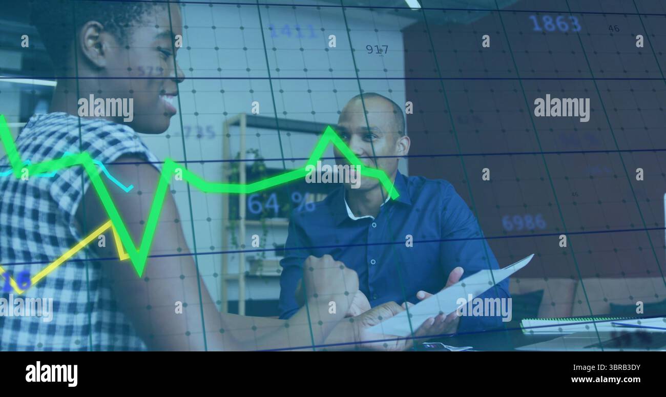 Analyzing colleagues in business attire reviewing data in office ...