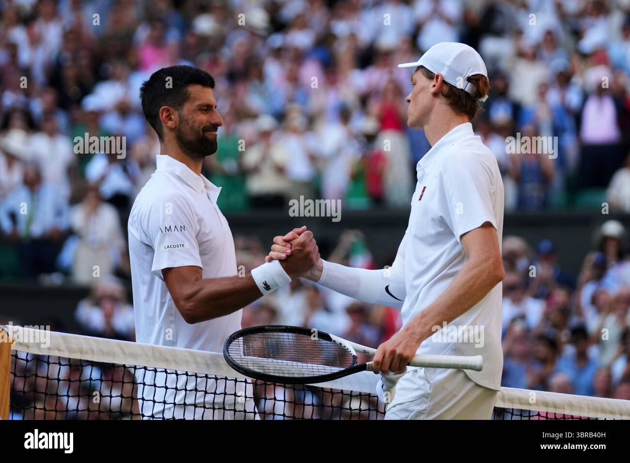 Jannik Sinner of Italy and Novak Djorkovic of Serbia shake hands after the men's semifinal ...