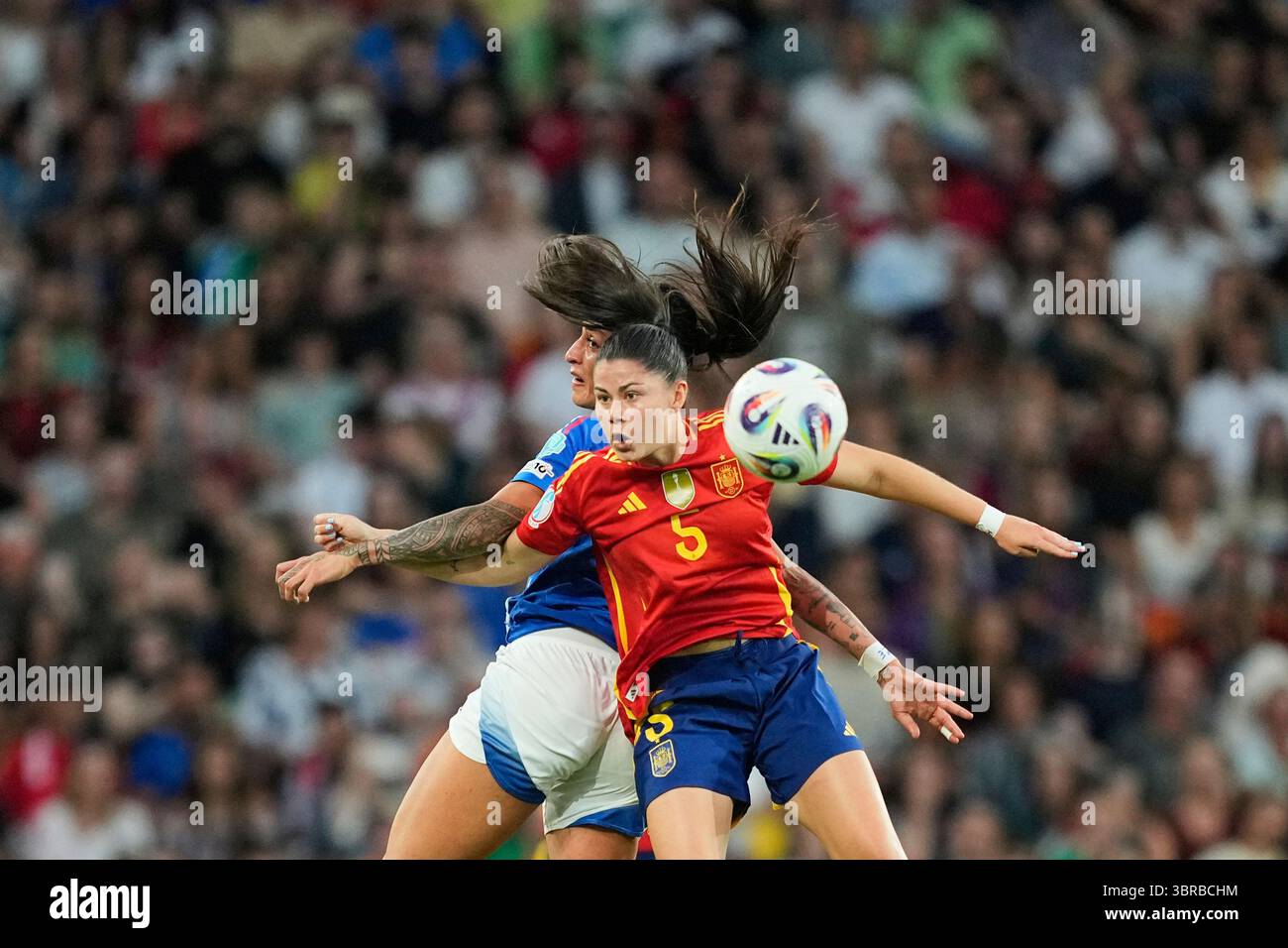 Spain's Maria Mendez jumps for the ball with Italy's Martina Piemonte ...
