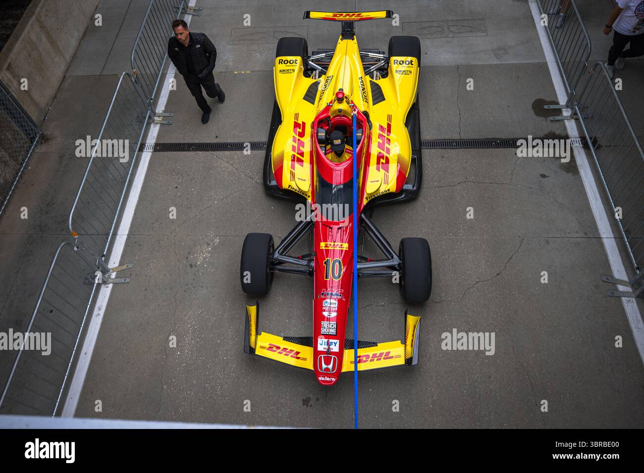 The crew of Chip Ganassi Racing Honda prepare their race cars for the ...