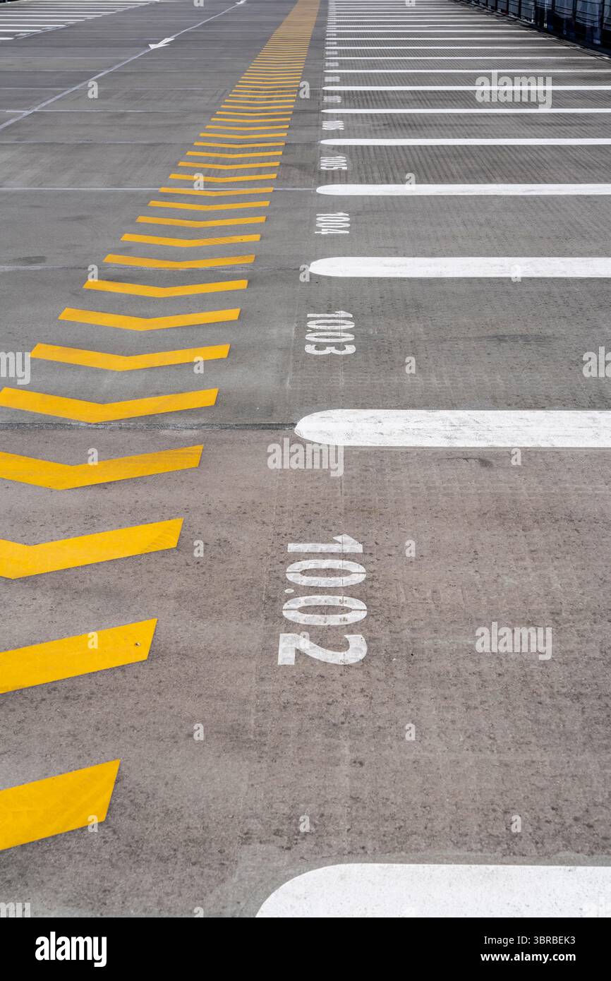 Markings on a parking deck, direction of travel markings, numbered ...