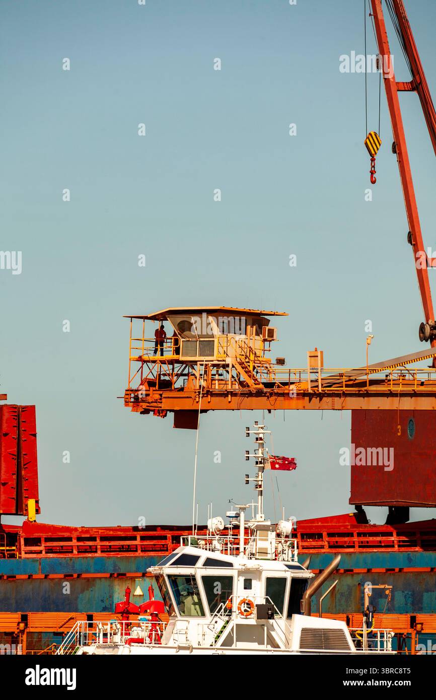 man standing foot bridge bauxite load ship hull rio tinto lorim point ...