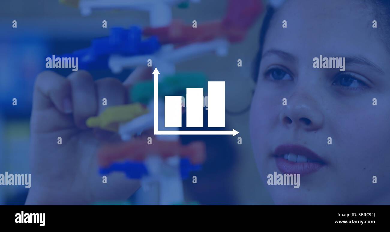 Student assembling molecular model in science lab, with colored ...