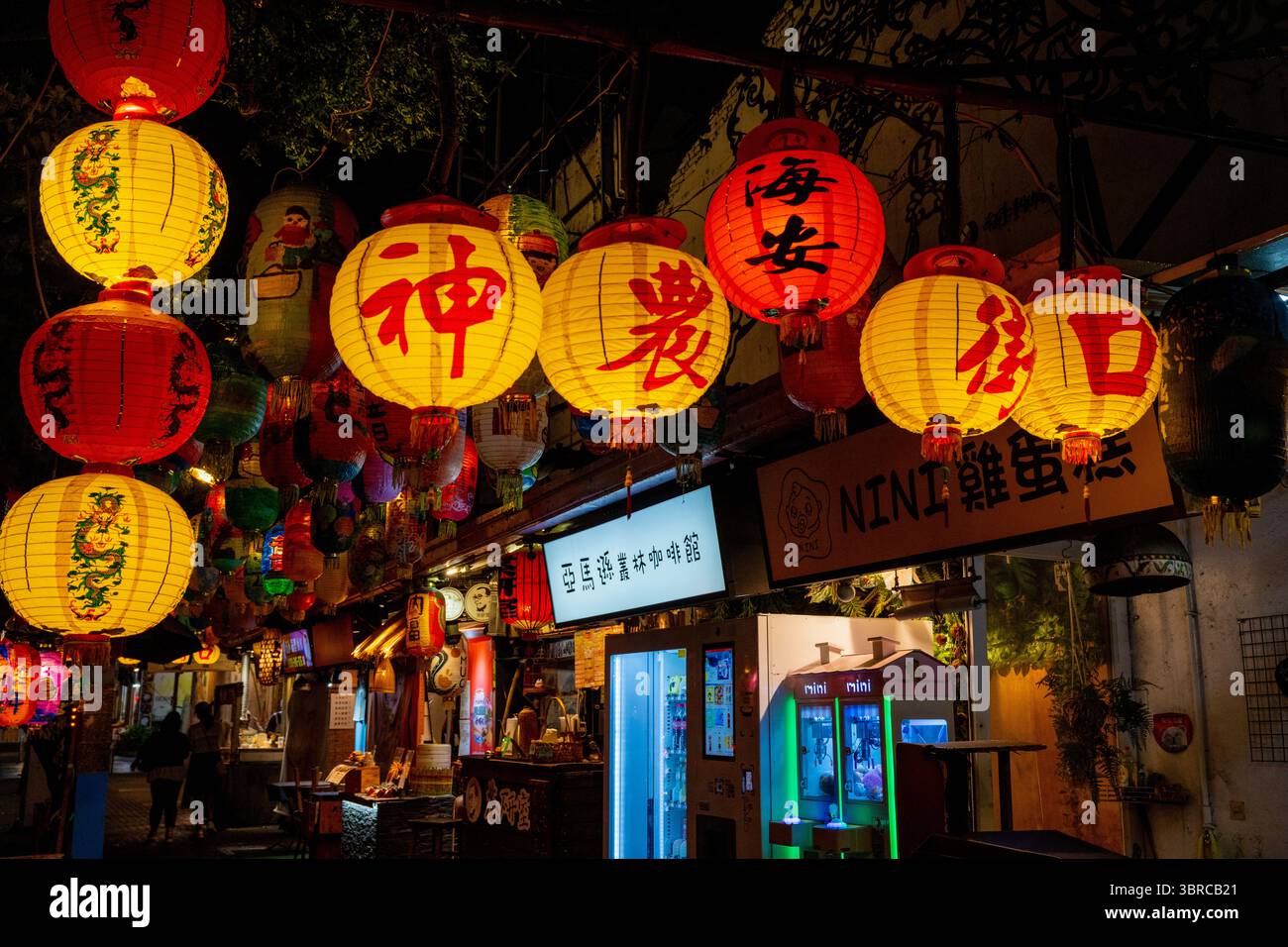 Tainan, Taiwan – Jun 29 2025: A vibrant evening view of Shennong Street ...