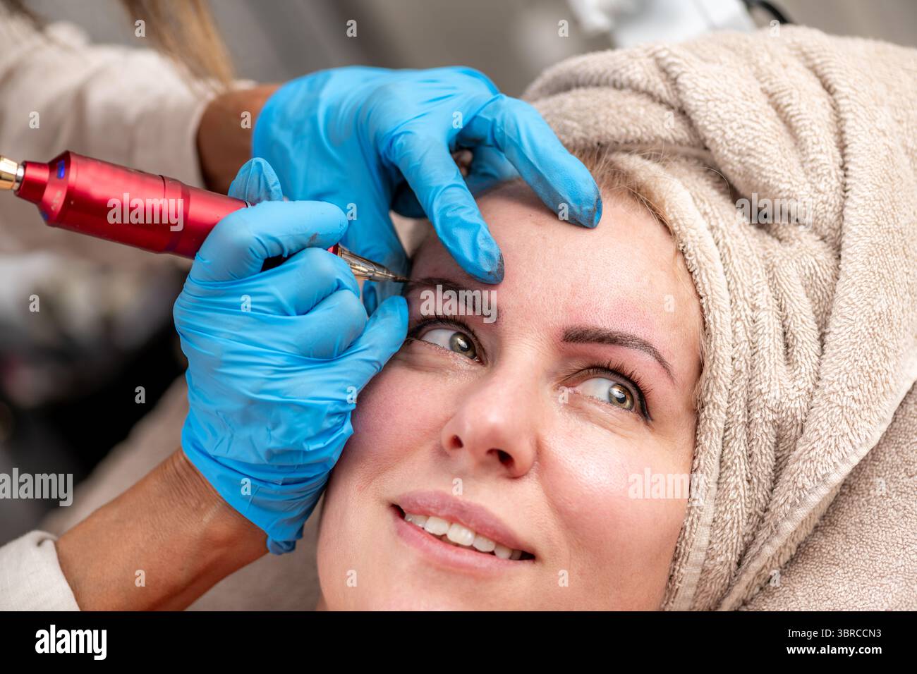 Microblading eyebrow tattoo procedure in hi-res stock photography and ...