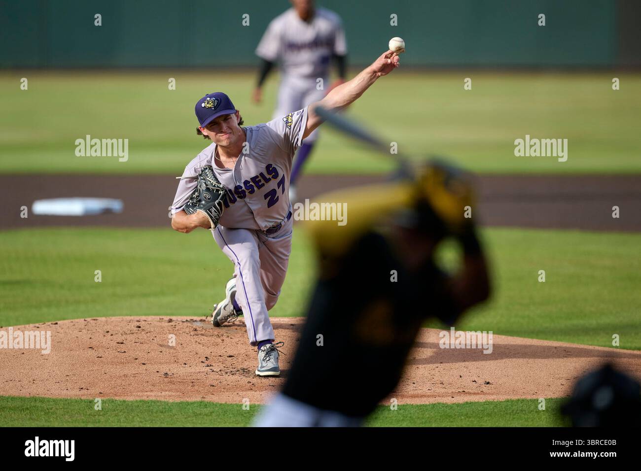 Fort Myers Mighty Mussels pitcher Michael Carpenter (27) delivers a ...