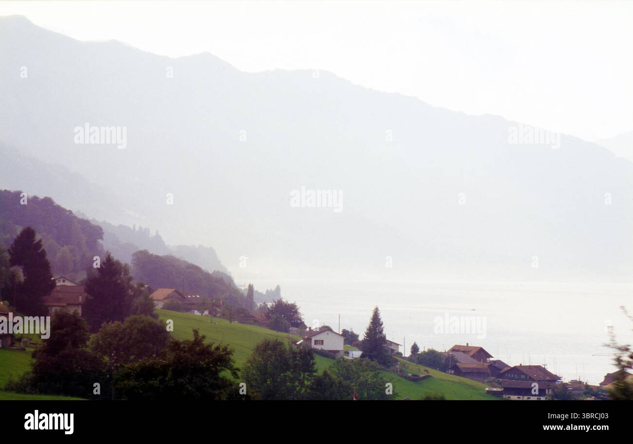 Misty Alpine Lakeside Villages, 1990s Switzerland Stock Photo - Alamy