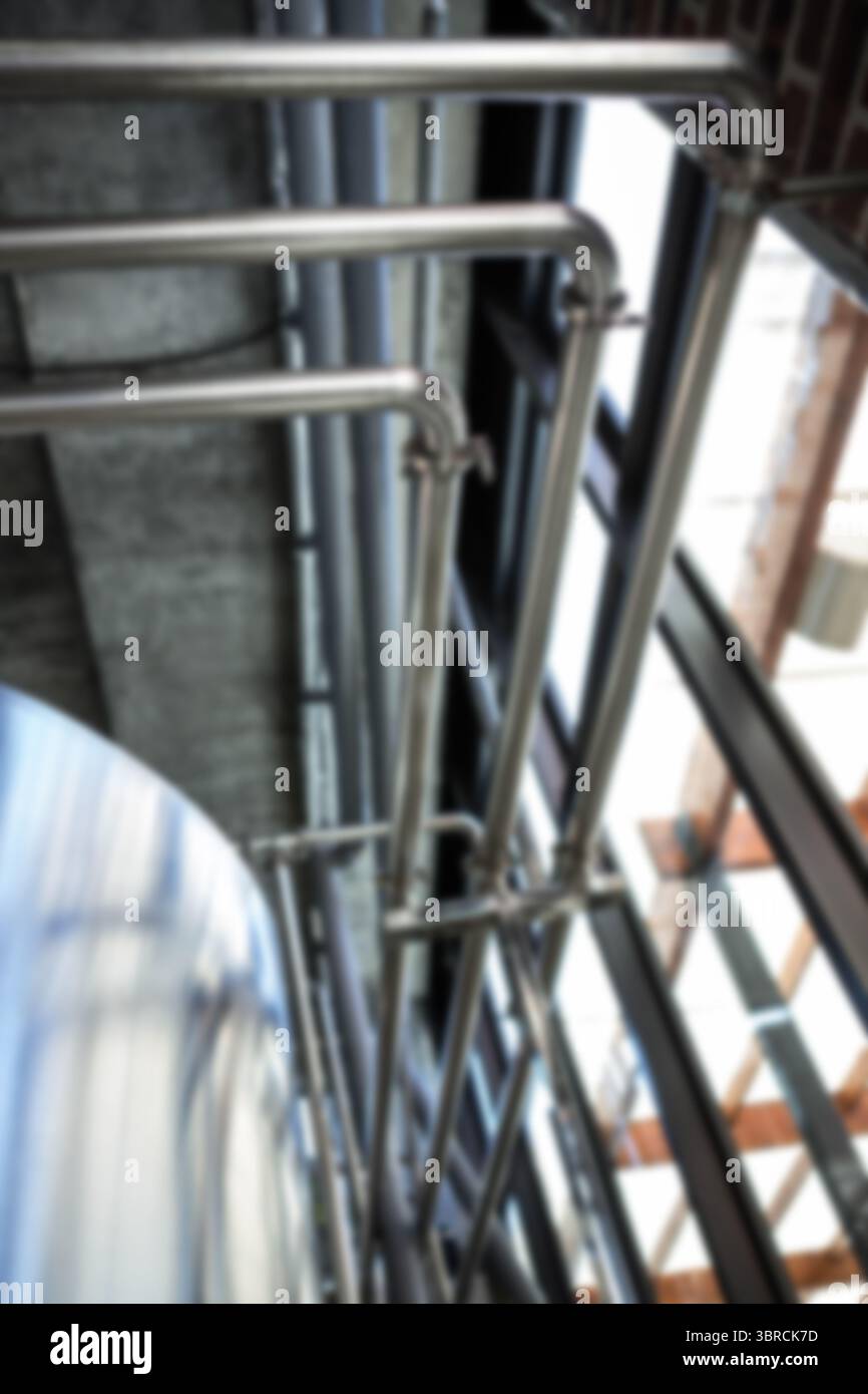 Curve pipes at distillery Stock Photo - Alamy