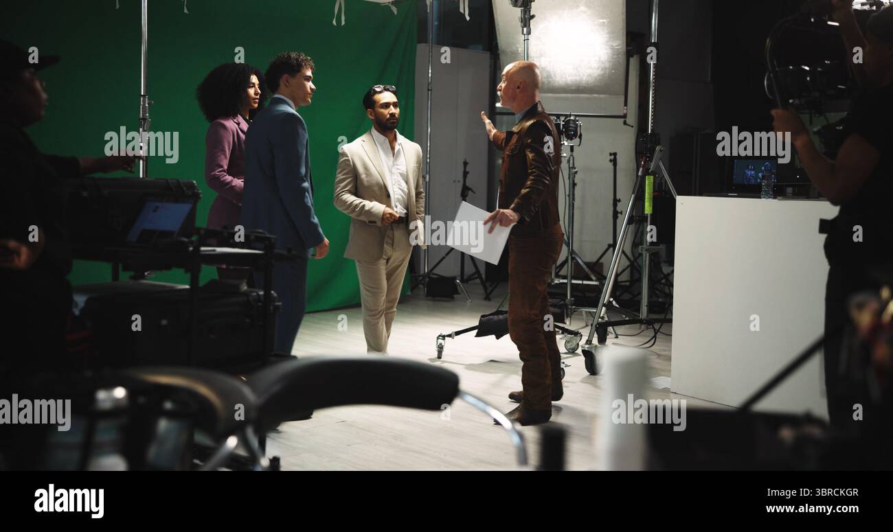 Director, script and instruction to actor on set for creative guidance ...