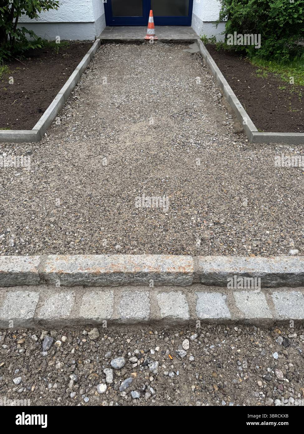 Walkway is being built with a cement border Stock Photo - Alamy