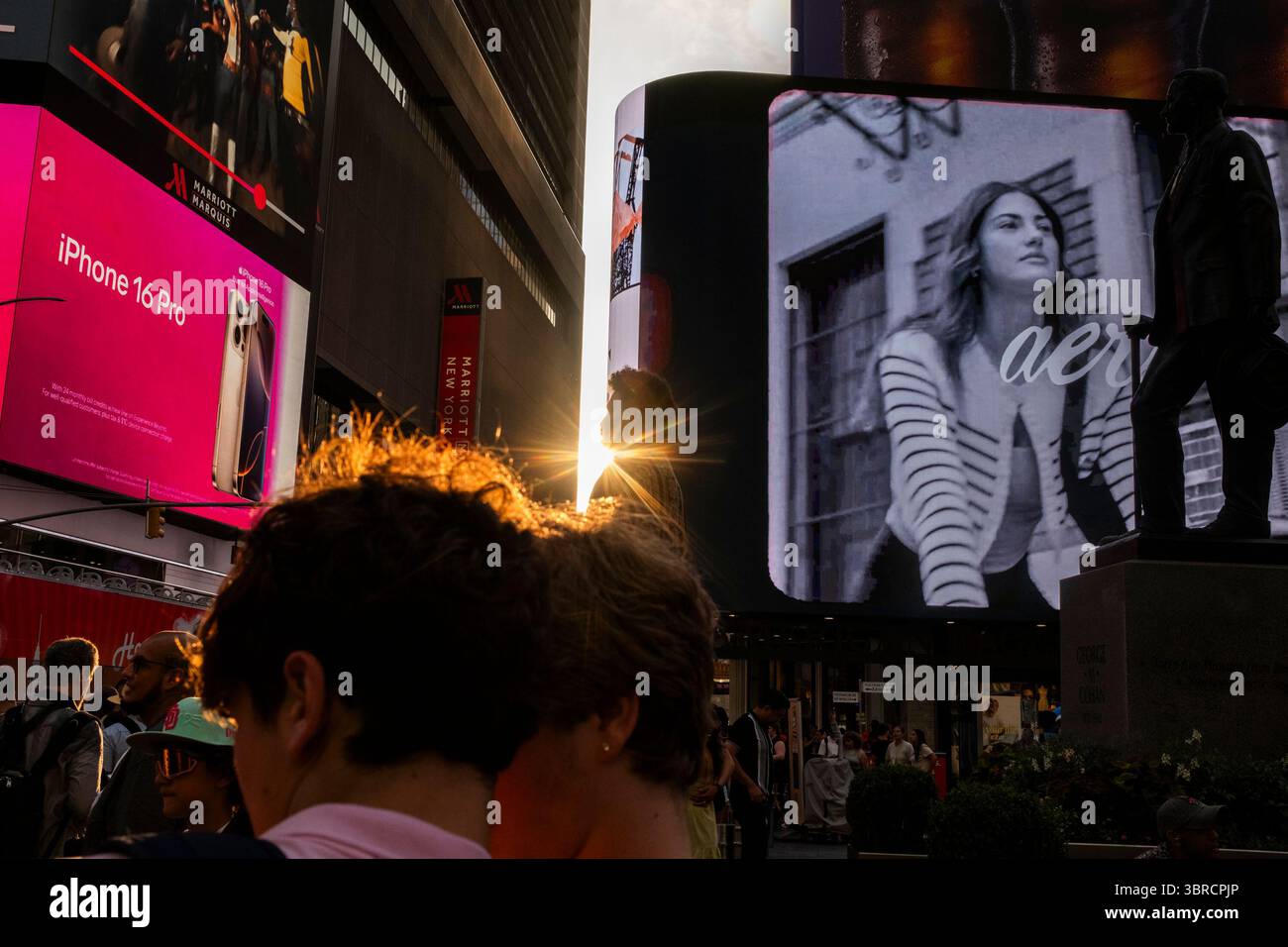 The second Manhattanhenge of the year is seen in Times Square in New ...
