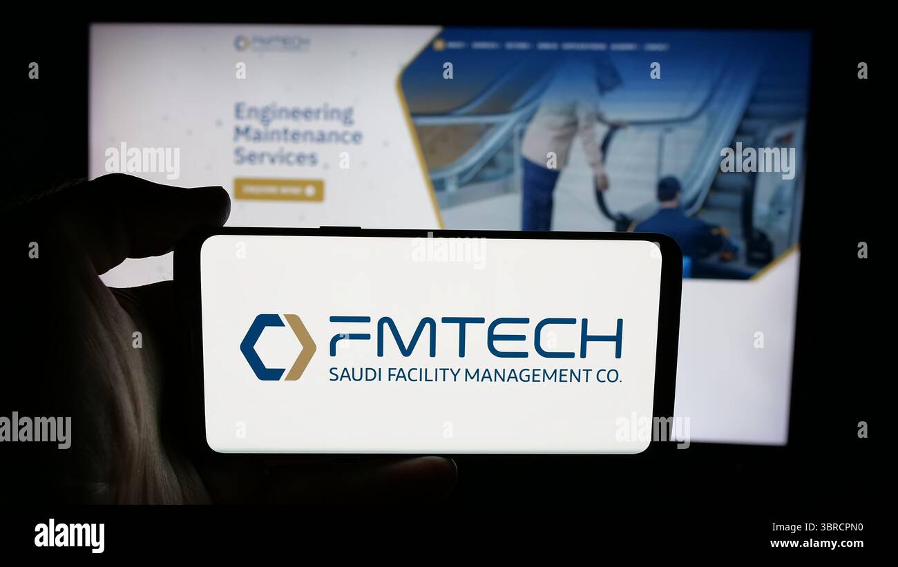 In this photo illustration, a person is holding a cellphone with the ...