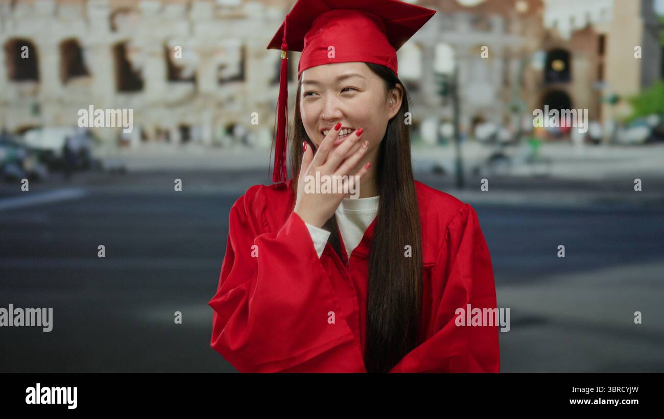 Woman in graduation attire smiling in front of the iconic roman ...
