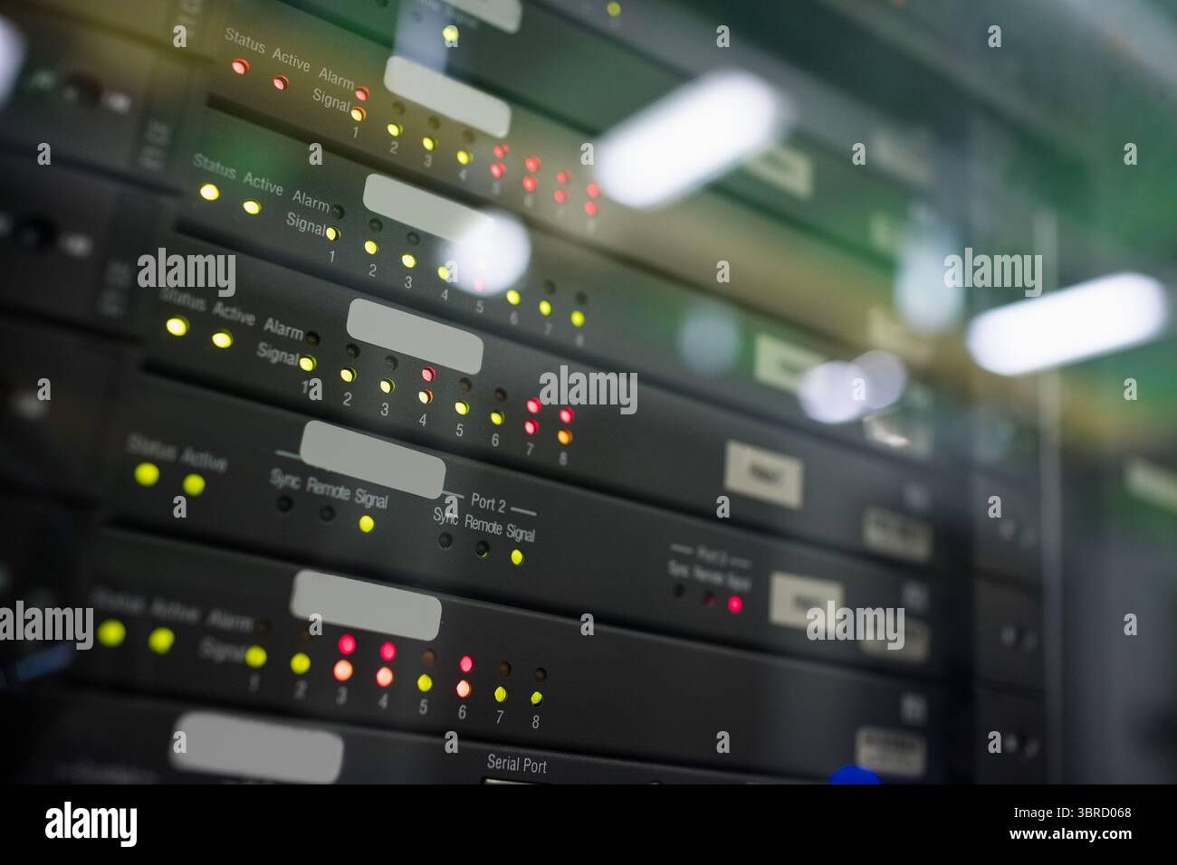 Rack-mounted network panels are showing glowing LED indicators and ...