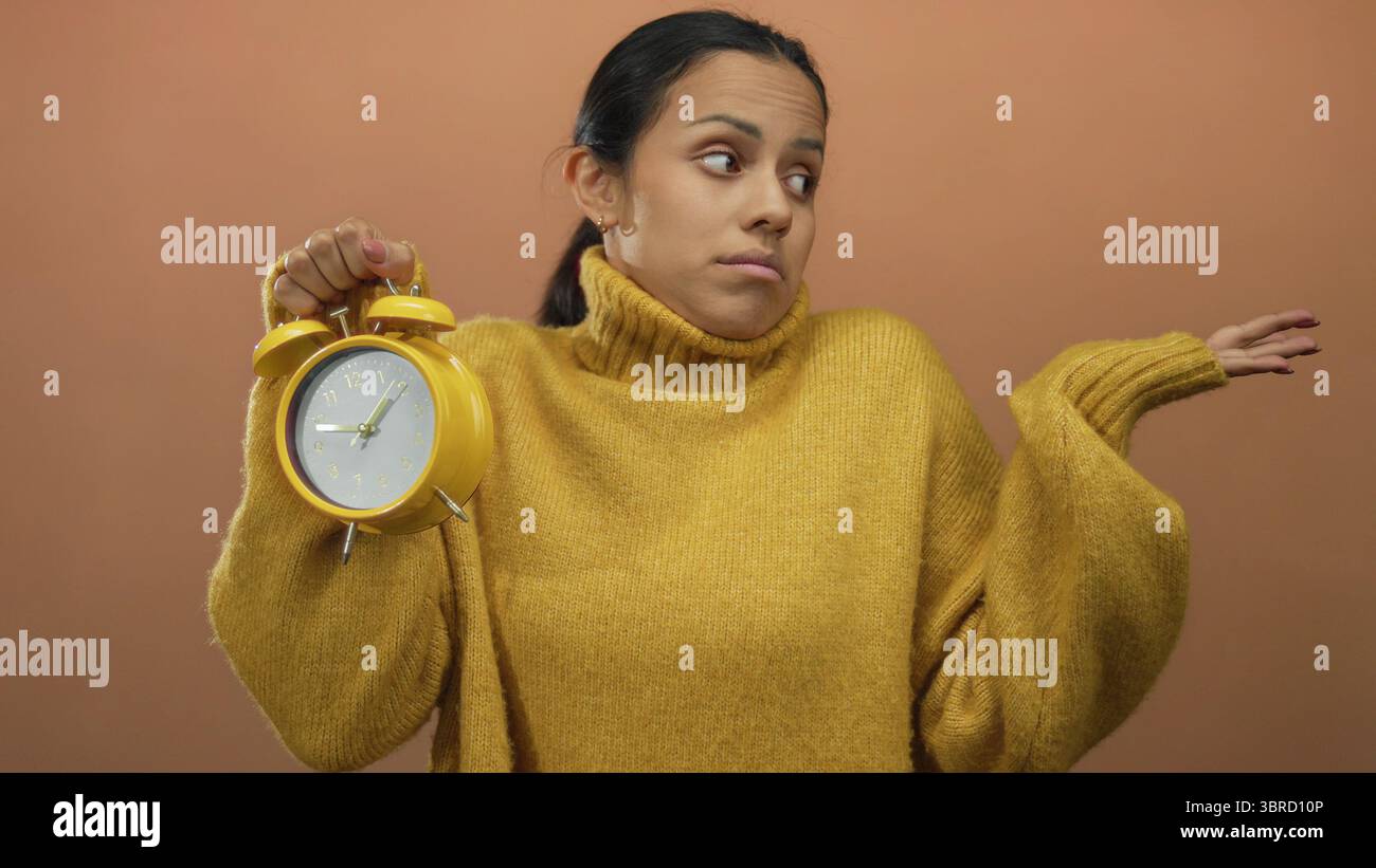 Woman shrugging yellow alarm hi-res stock photography and images - Alamy