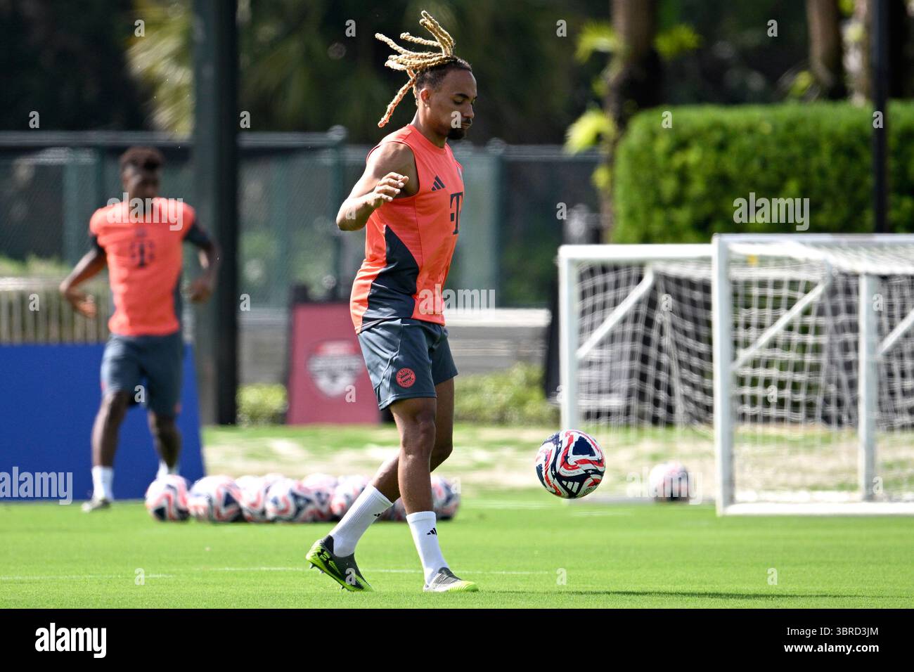 FC Bayern Munich defender Sacha Boey kicks a ball during practice for ...