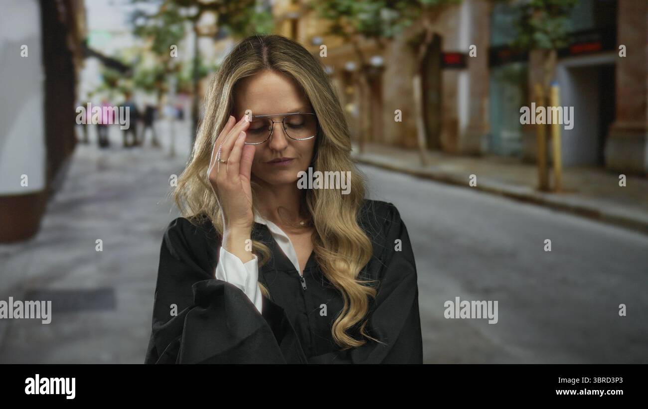 Blonde woman in judge uniform stands confidently outdoors on a city ...