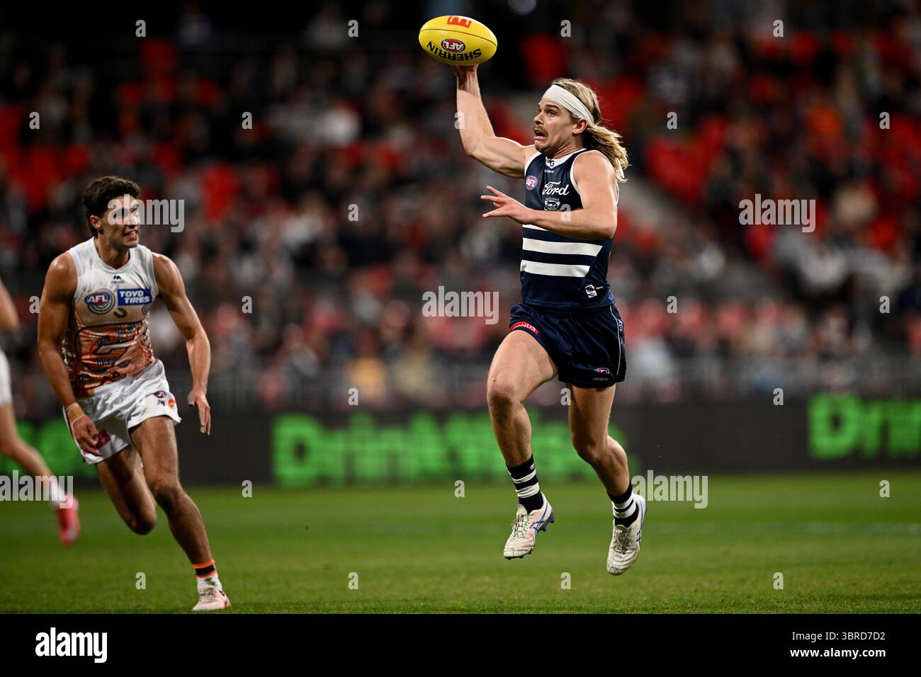 Bailey Smith of the Cats controls the ball during the AFL Round 18 ...