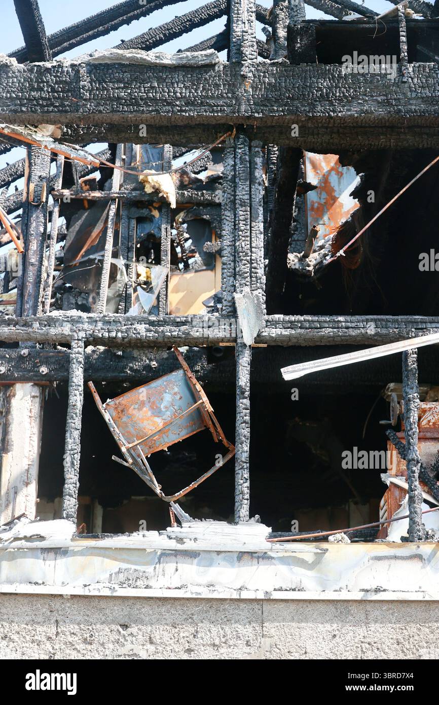 A building is on fire and has been destroyed Stock Photo - Alamy