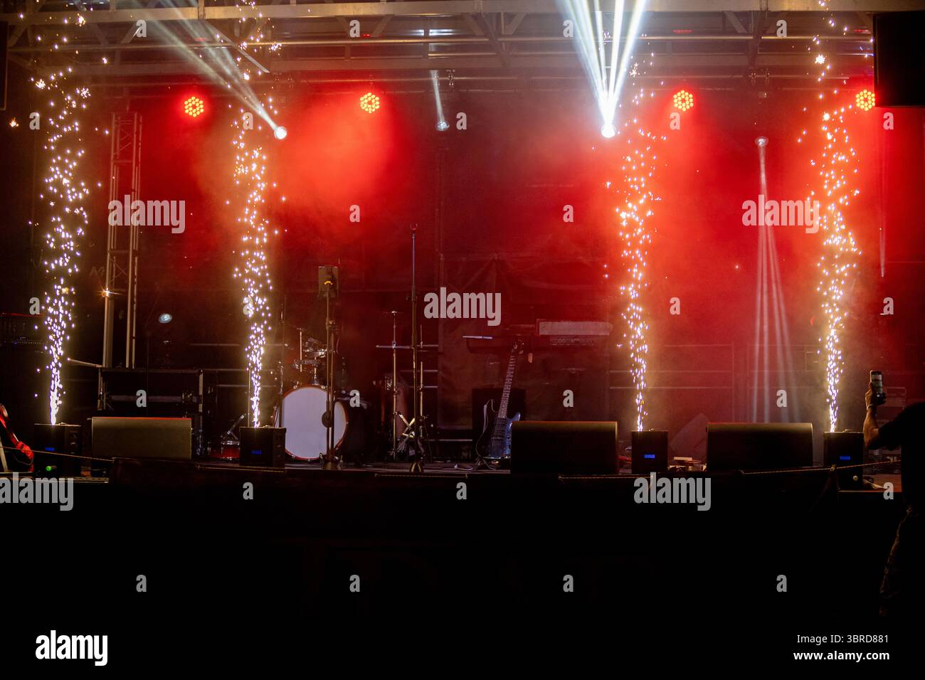 A vibrant concert setup with dazzling lights is ready for an ...