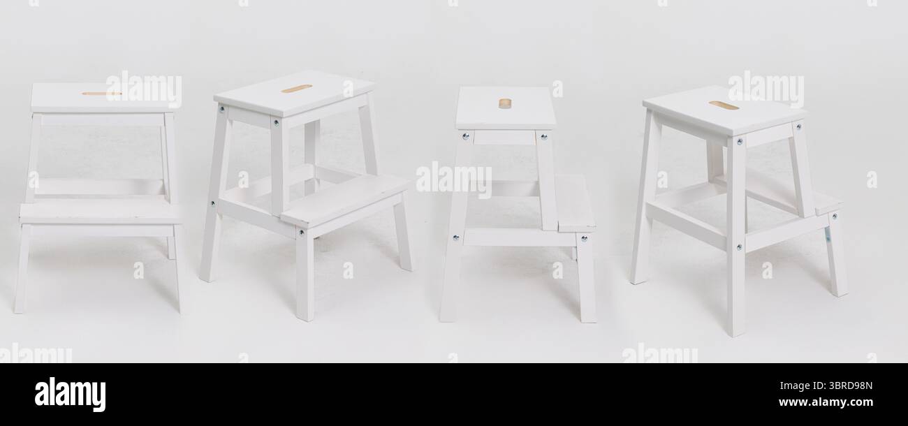 This is a versatile white folding step stool, perfect for various home ...