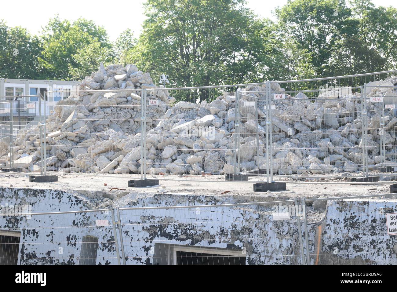 A pile of rubble sits on top of a building Stock Photo - Alamy