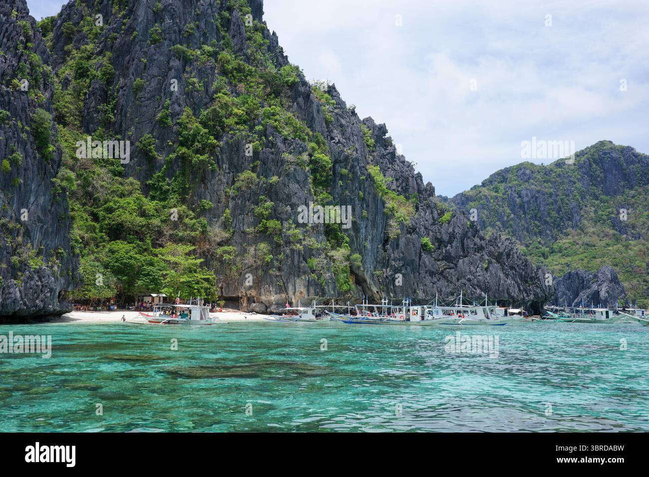 A landscape of majestic limestone island rising dramatically from ...