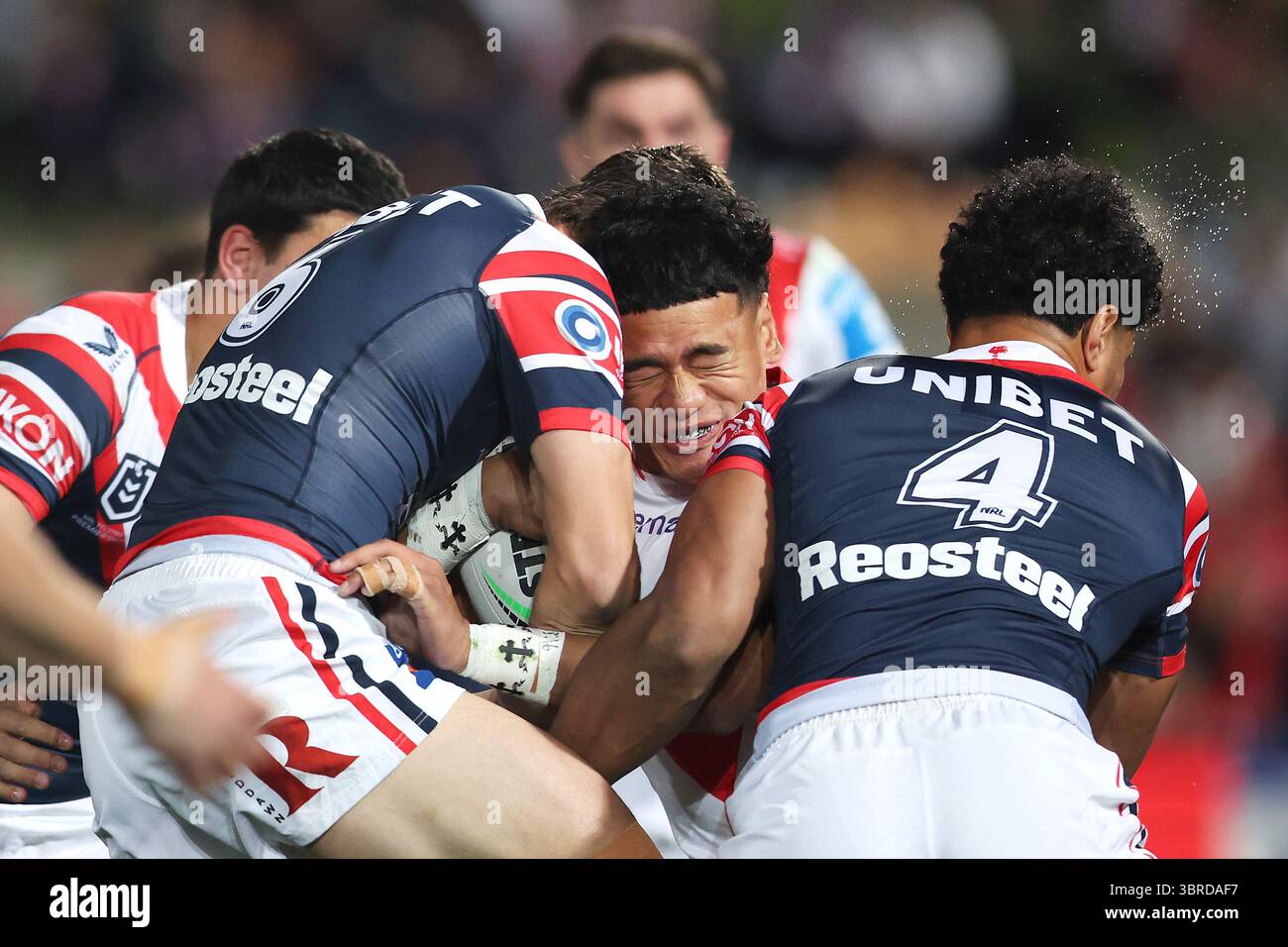 Sione Finau of the Dragons is tackled during the NRL Round 19 match ...