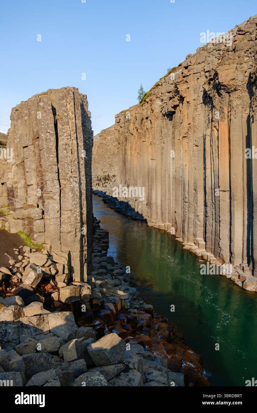 Studlagil Canyon in Iceland features towering basalt columns and a ...