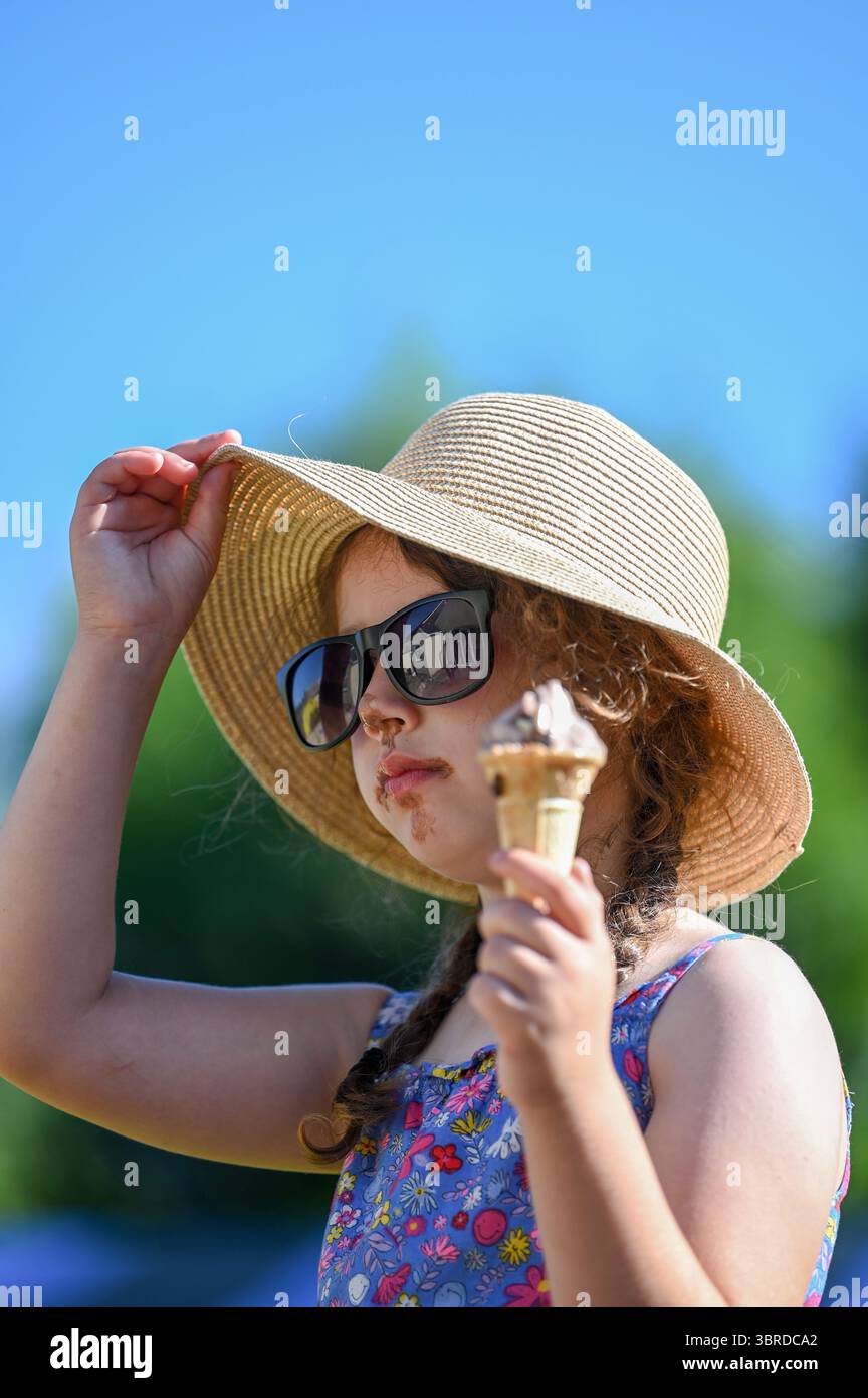 Swansea 12th August 2025, Weather Lillian Joy aged seven enjoys an ice ...