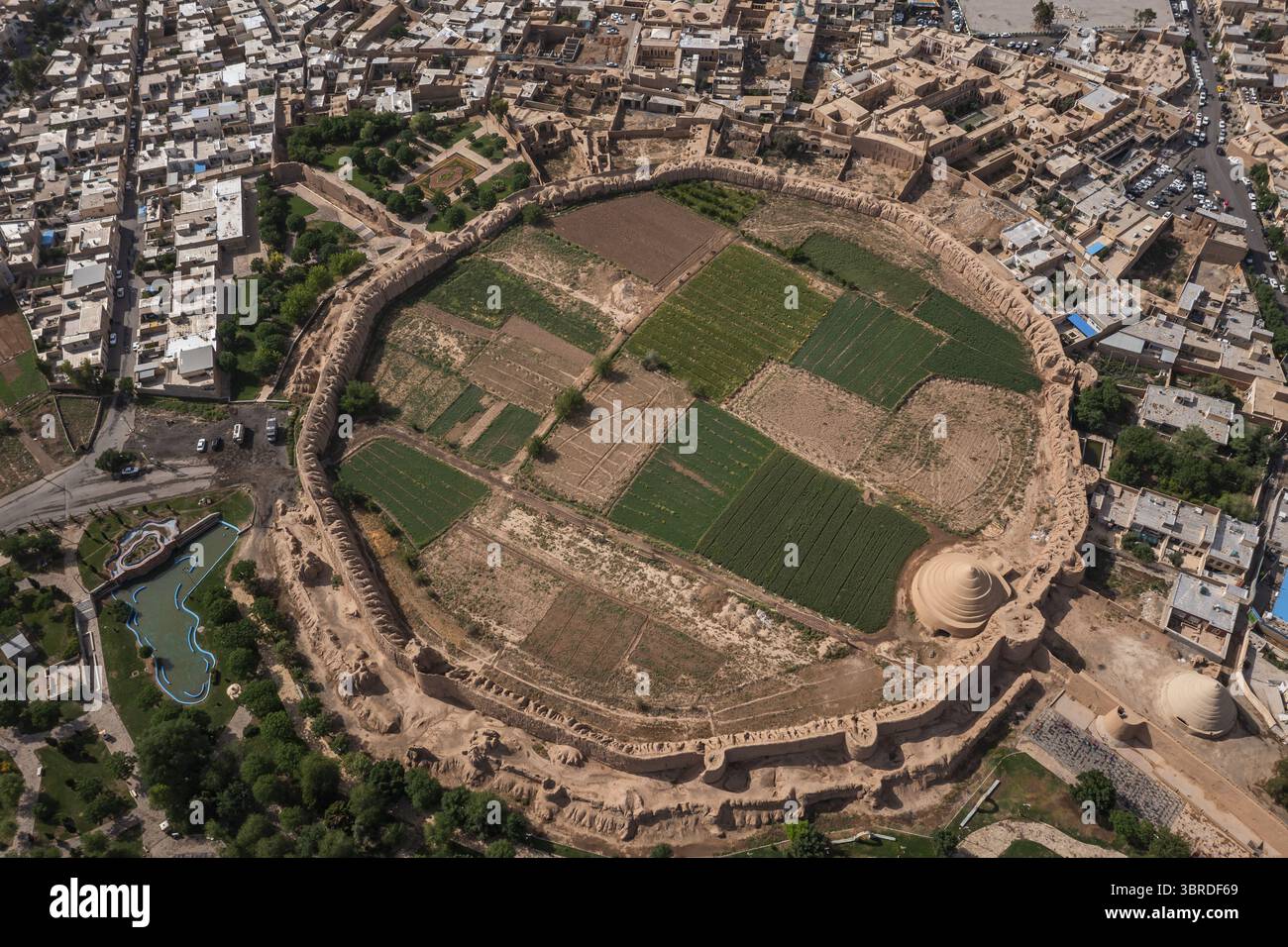 Aerial view of the Arg-e Rayen, a majestic mud-brick citadel with ...