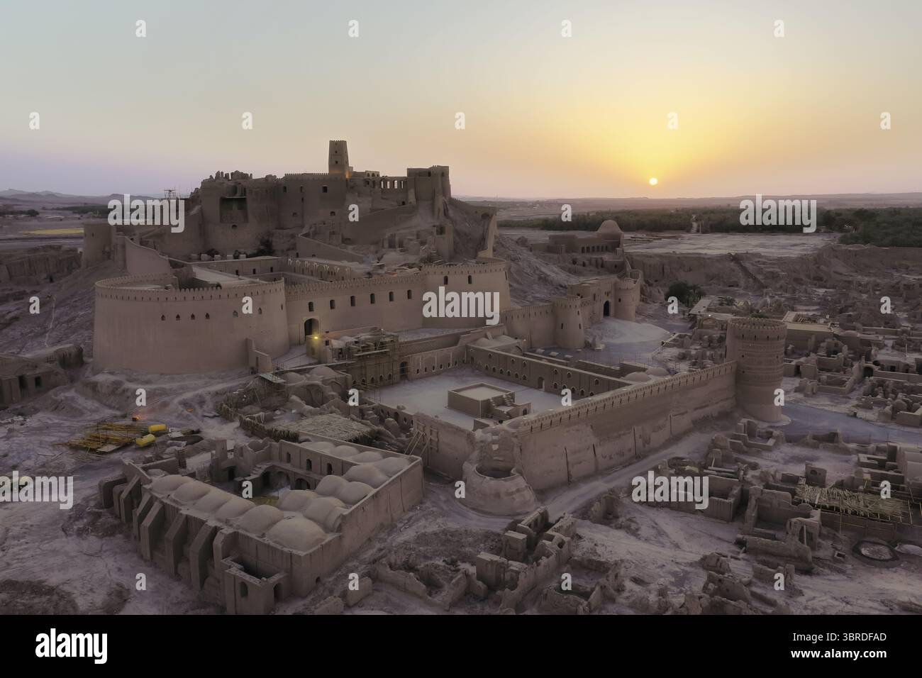Aerial view of the ancient Arg-e Bam citadel glows with warm hues under ...