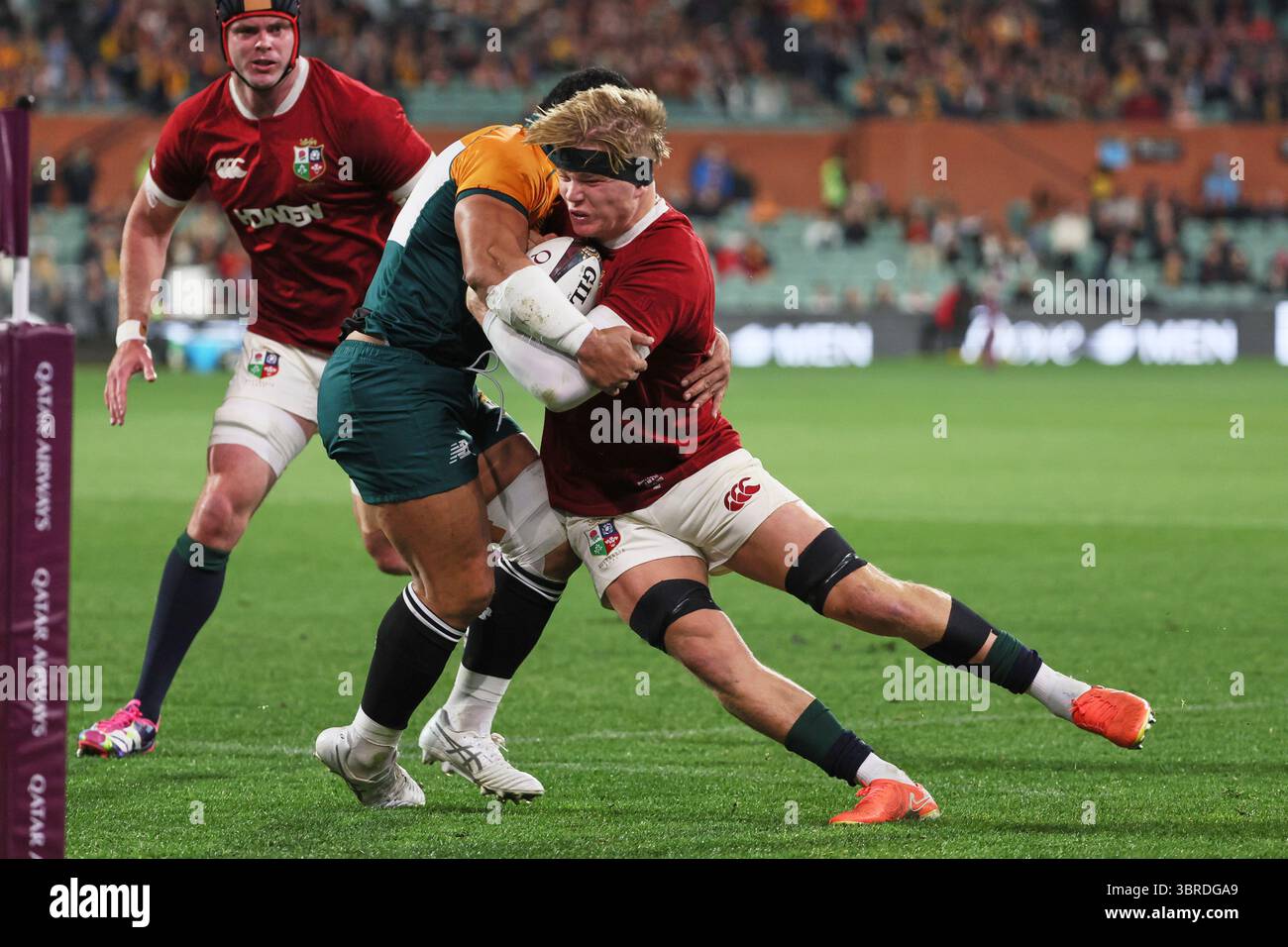 Henry Pollock of the British & Irish Lions is tackled during the rugby match between the Lions ...