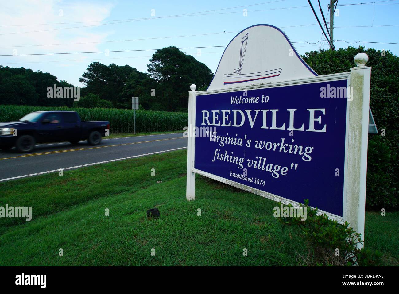A truck drives past a nautically themed welcome sign in the Northern ...