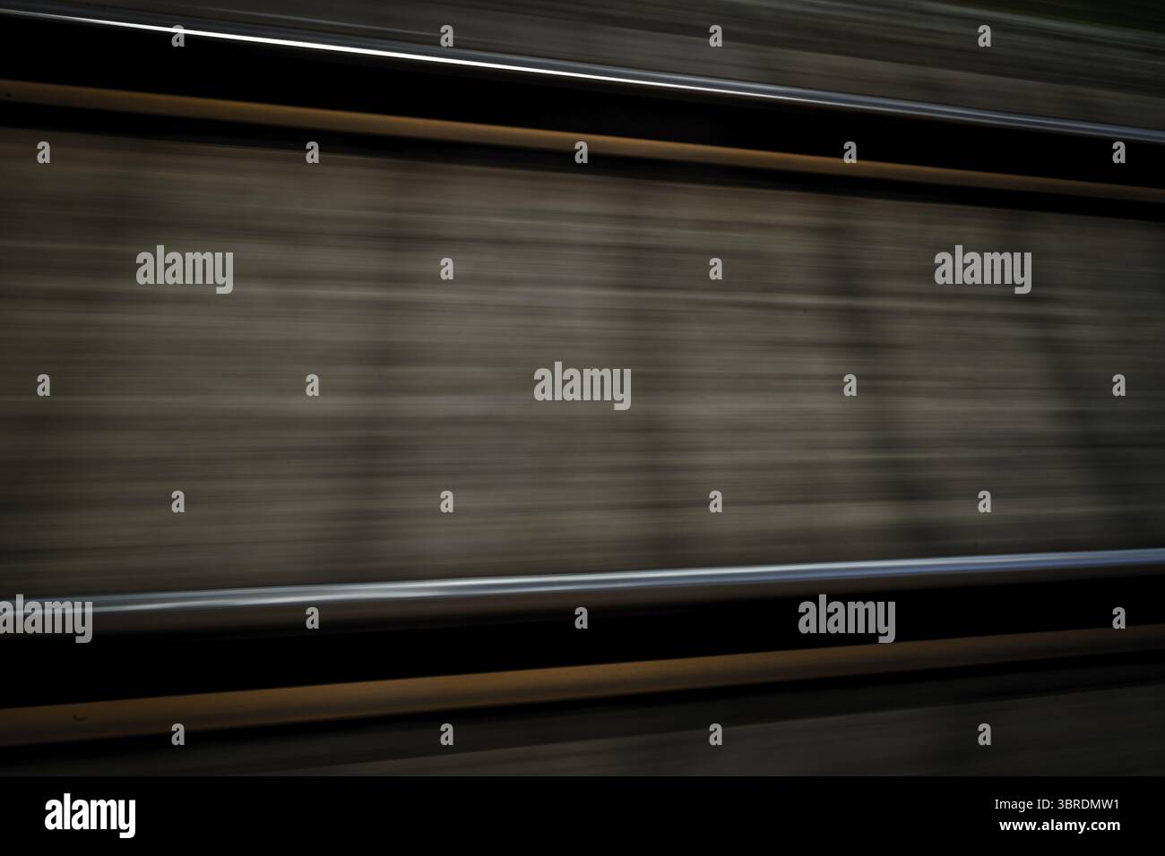 Rails in motion, the view from the window of a moving train, captured ...