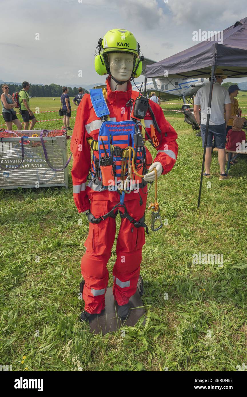 White fashion mannequin with disaster control equipment at the airfield ...