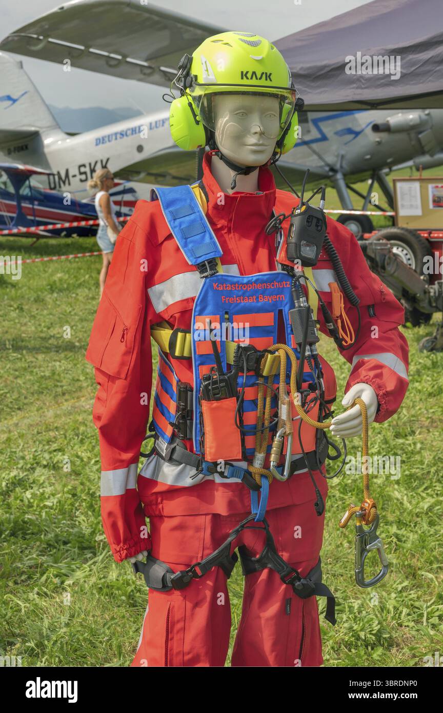 White fashion mannequin with disaster control equipment at the airfield ...