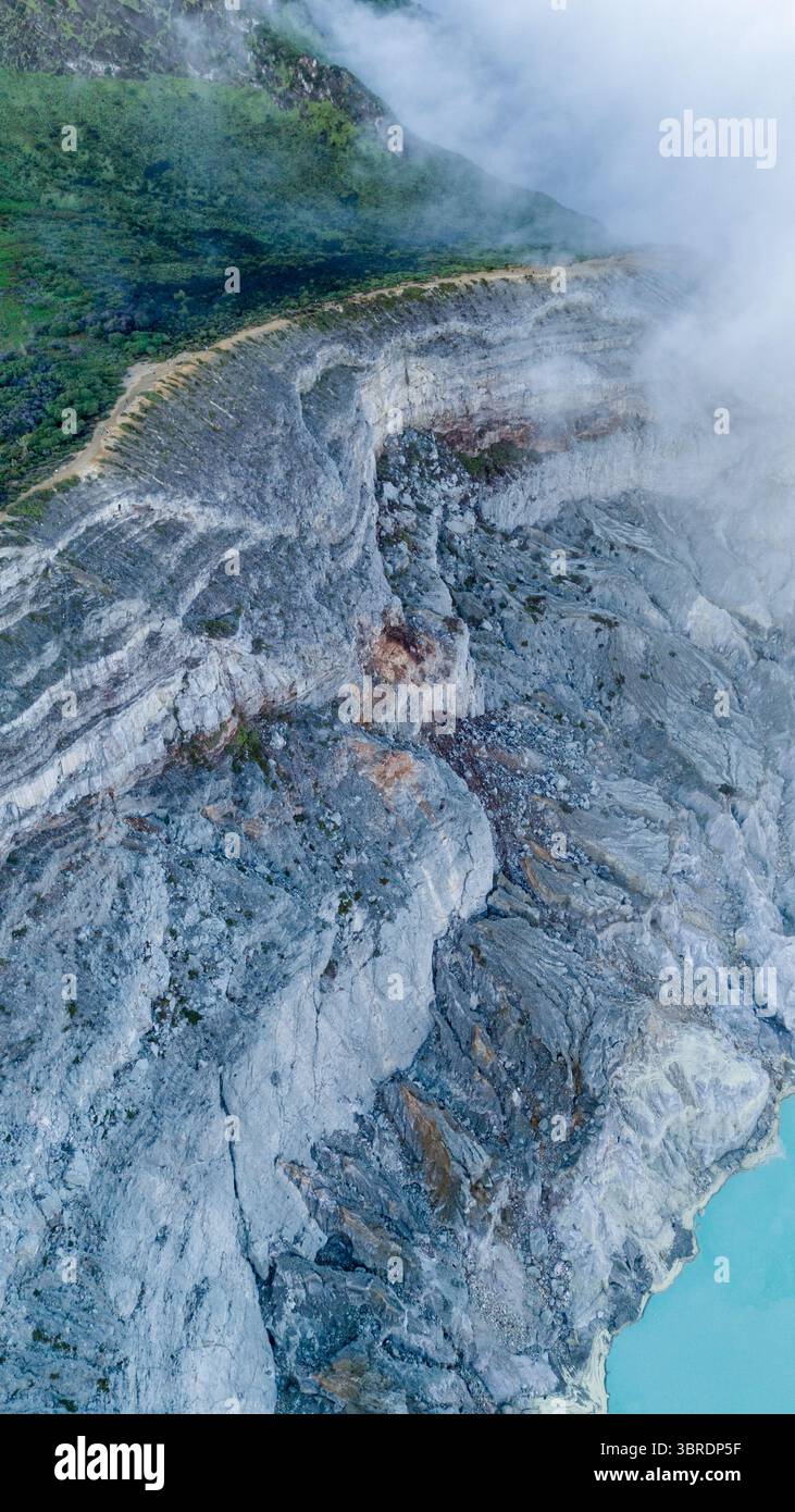 Aerial view of the rugged terrain and sulfuric mist mingling with the ...