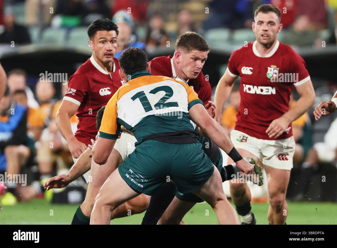 Owen Farrell of the British & Irish Lions runs at David Havili of the AUNZ Invitational XV ...