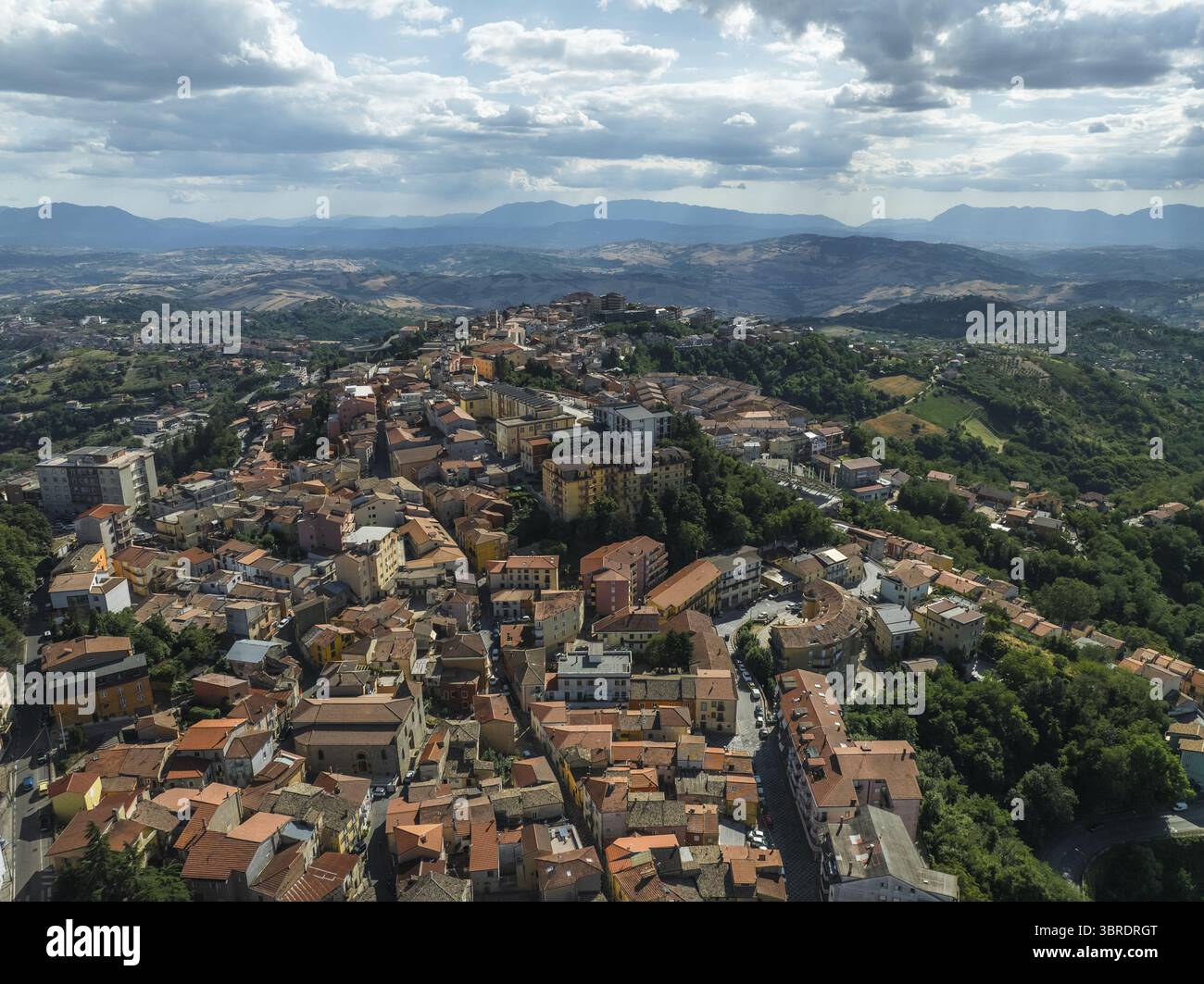 Aerial view of terracotta rooftops cascading down the hillside ...