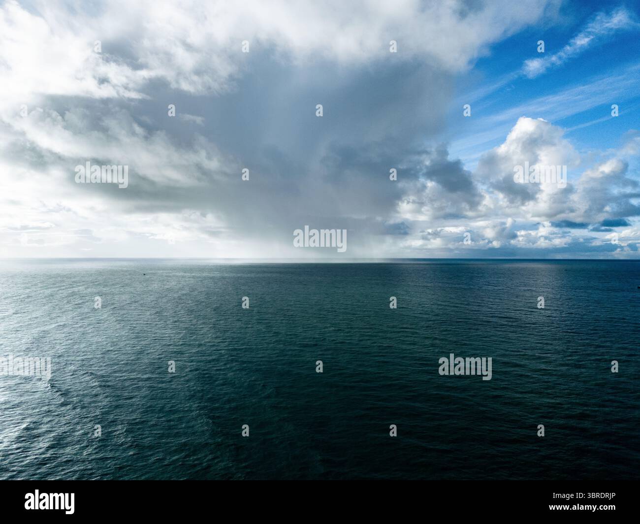 Beautiful clouds over ocean hi-res stock photography and images - Alamy
