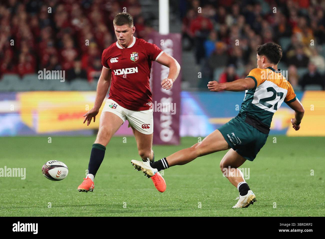 Owen Farrell of the British & Irish Lions kicks the ball past Kalani ...