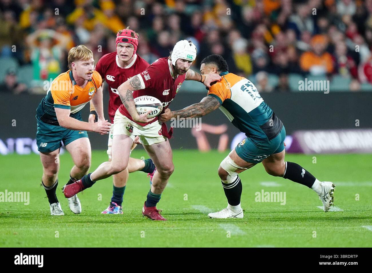 British and Irish Lions' Mack Hansen (centre) breaks past AUNZ ...