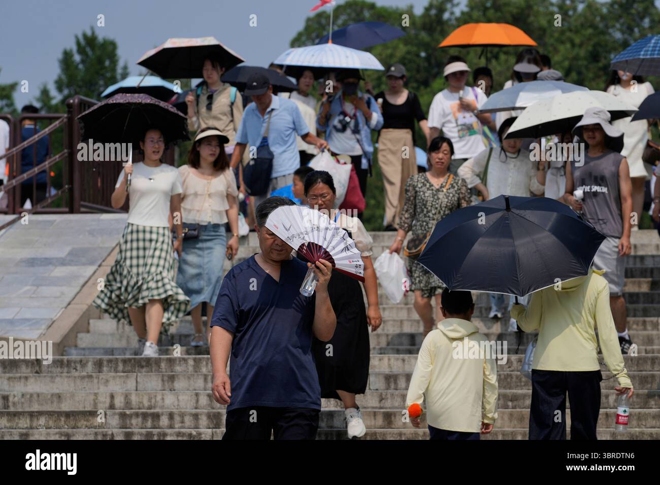 Visitors walk down steps at the Temple of Heaven in Beijing, China ...