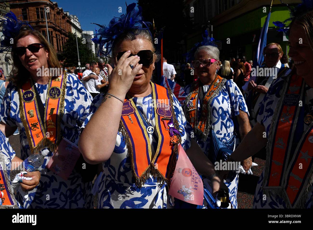 People take part in a Twelfth of July parade in Belfast, part of the ...