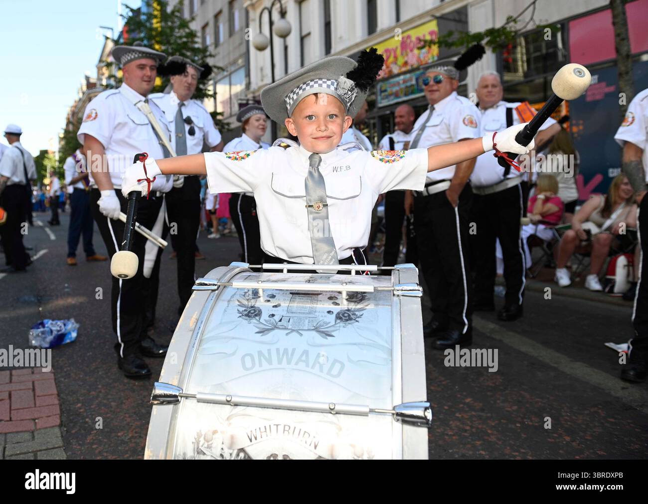 People take part in a Twelfth of July parade in Belfast, part of the ...