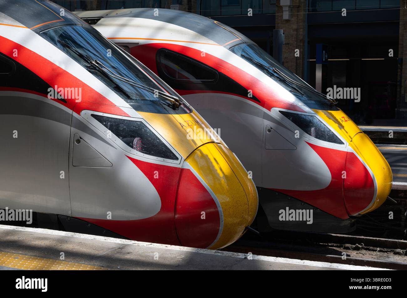 Two streamlined trains awaiting departure in Kings Cross Station ...
