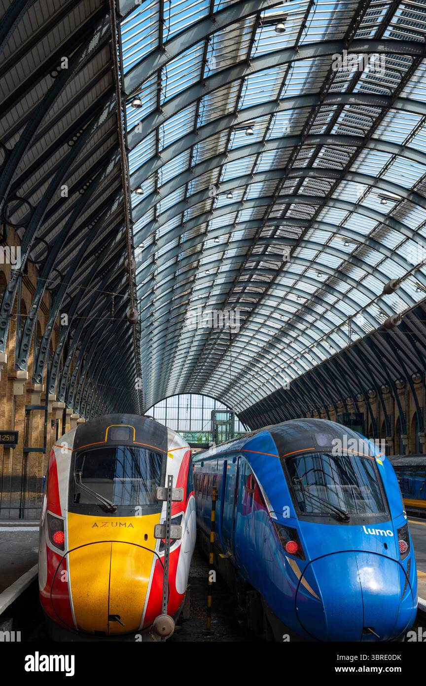 Two streamlined trains awaiting departure in Kings Cross Station ...